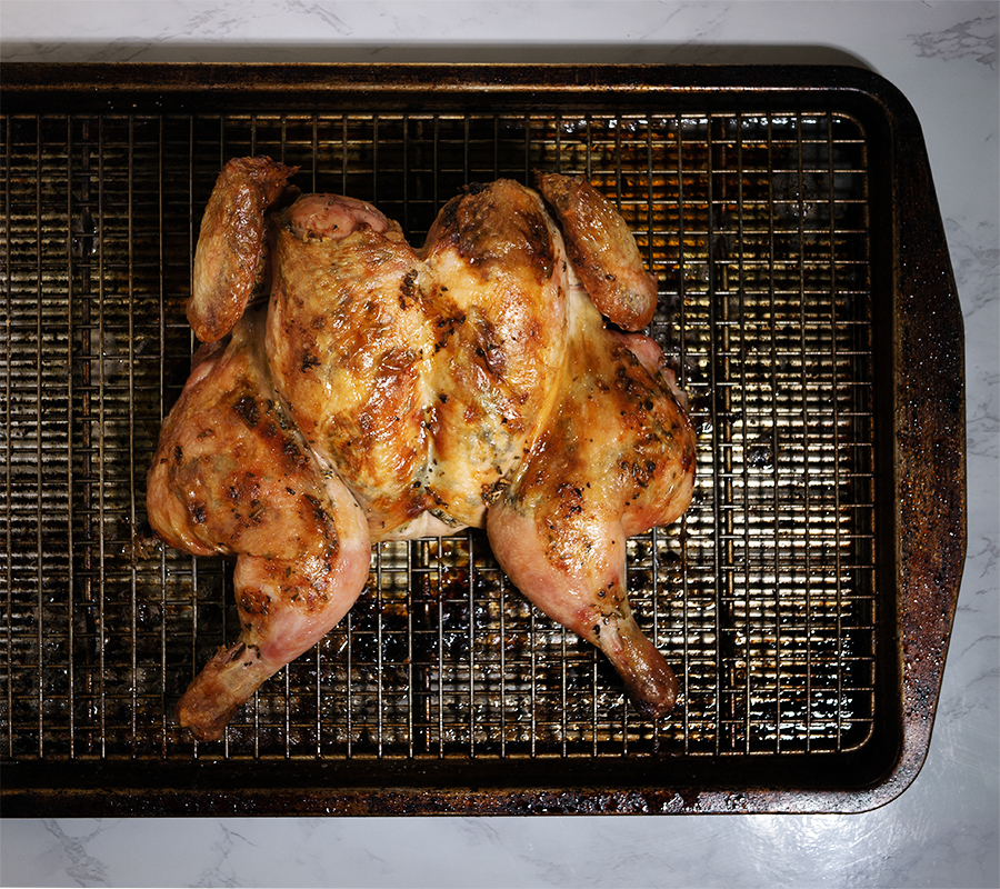 Spatchcock Chicken with Garlic Herb Butter - The Taste Tribune